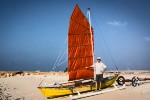Outrigger sailing canoe with junk rig sail on Socotra island